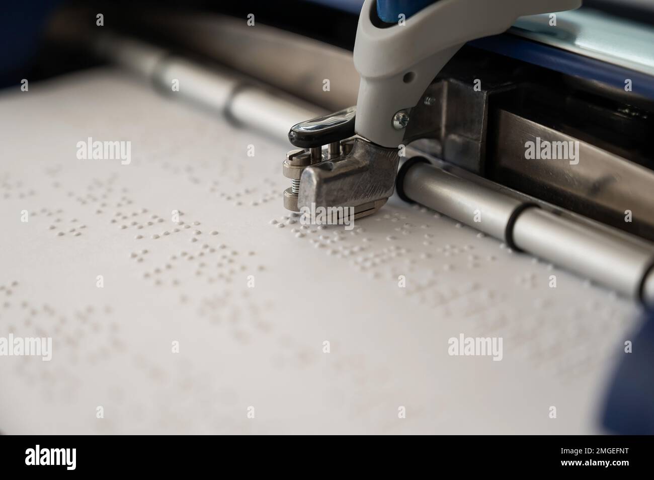 Close-up of a braille code printing machine Stock Photo - Alamy