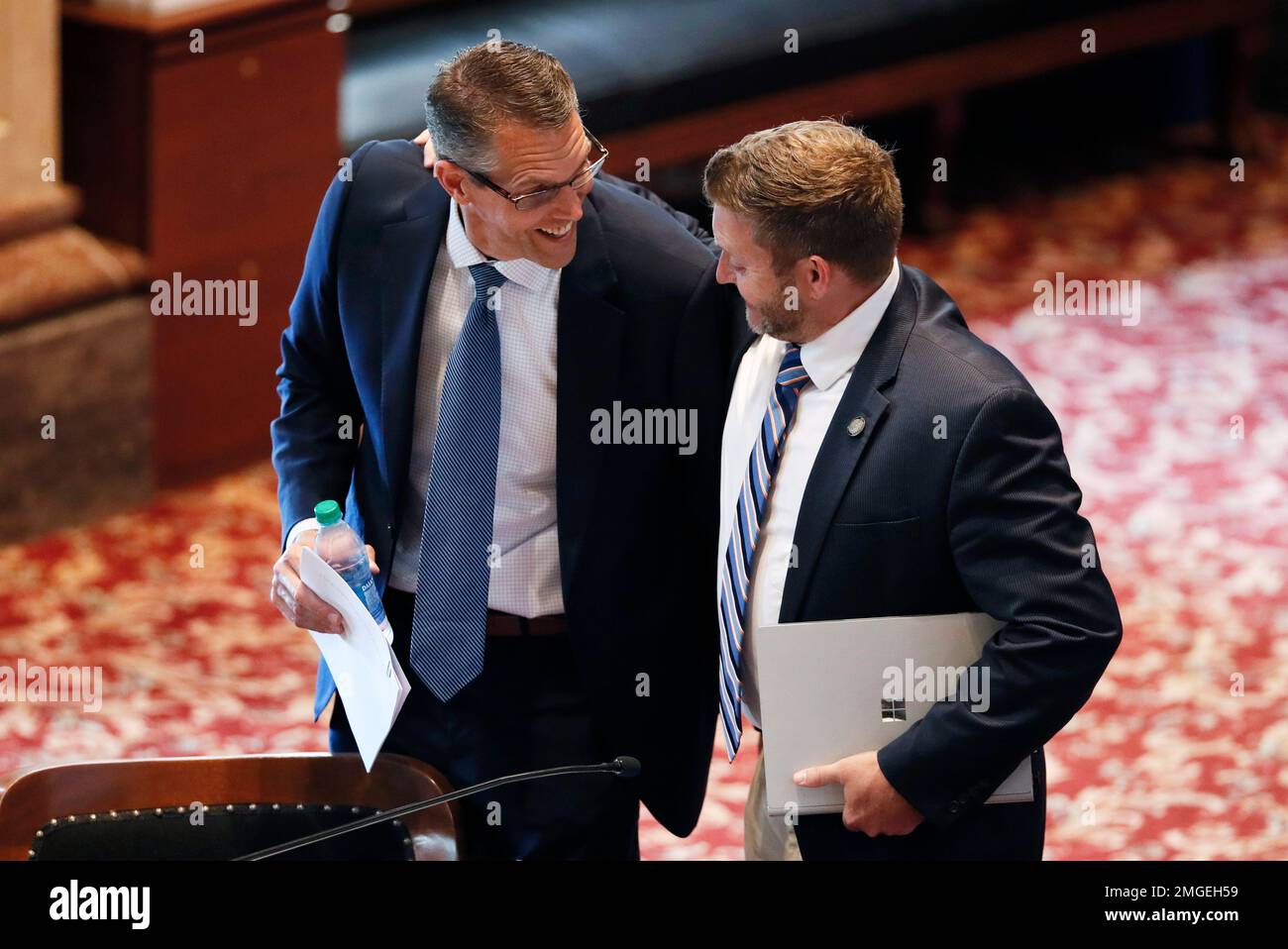 Sen. Randy Feenstra, R-Hull, left, laughs with Sen. Jake Chapman, R ...