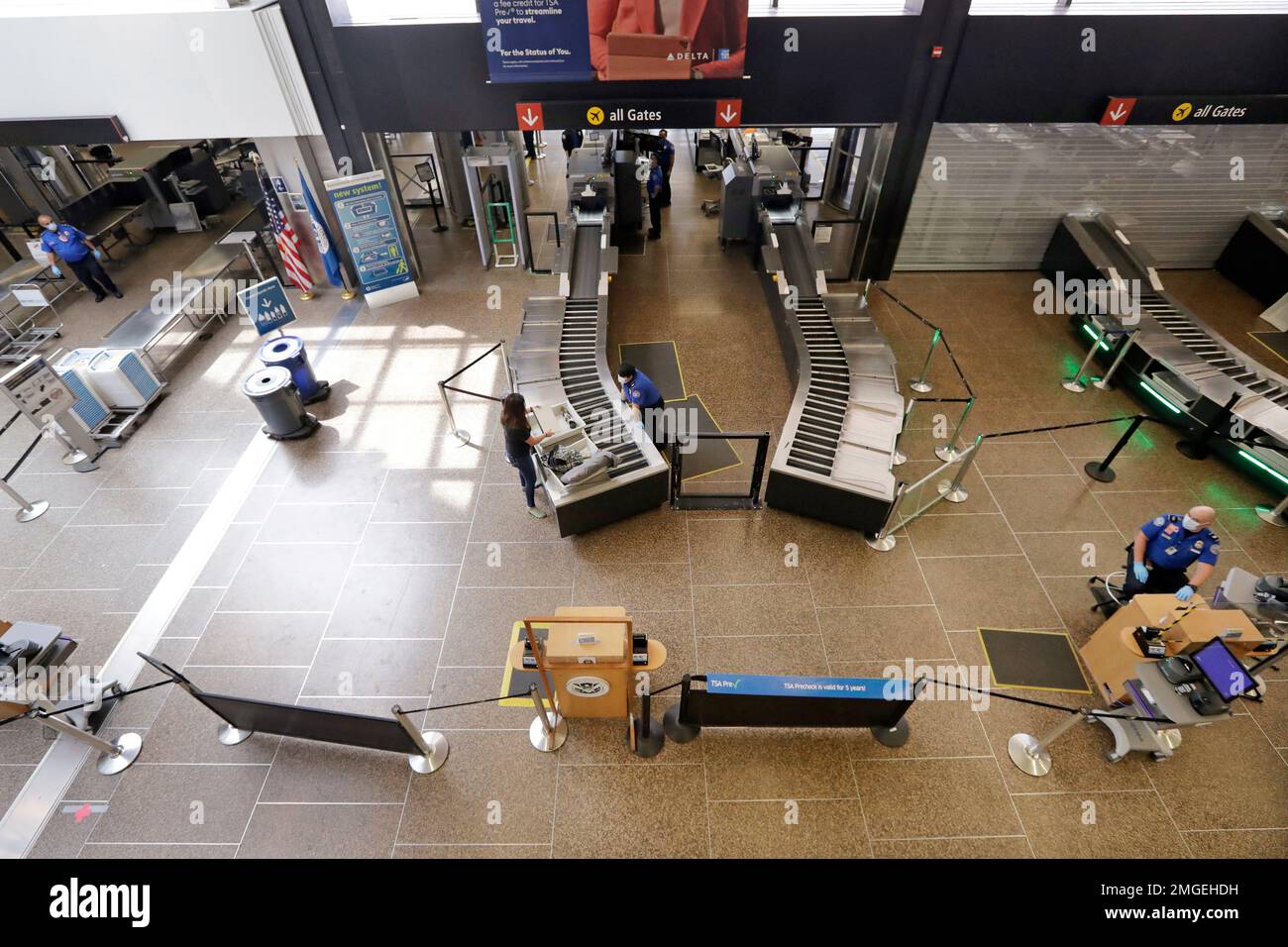 In this photo taken May 18, 2020, a lone traveler goes through a ...