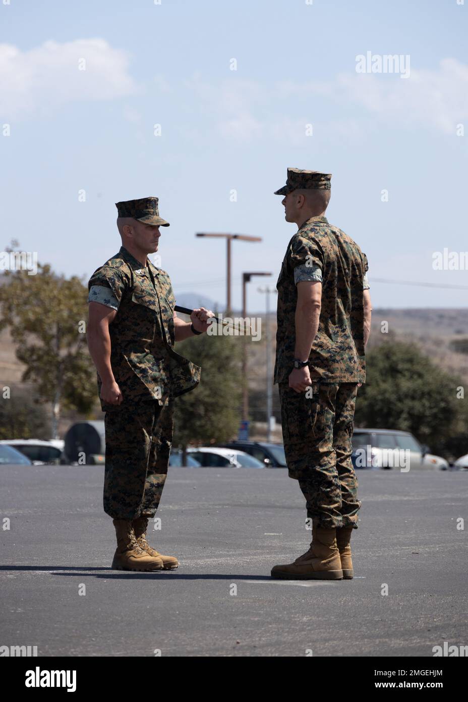 U.S. Marine Corps Sgt. Maj. Roland McGinnis (left), the outgoing ...
