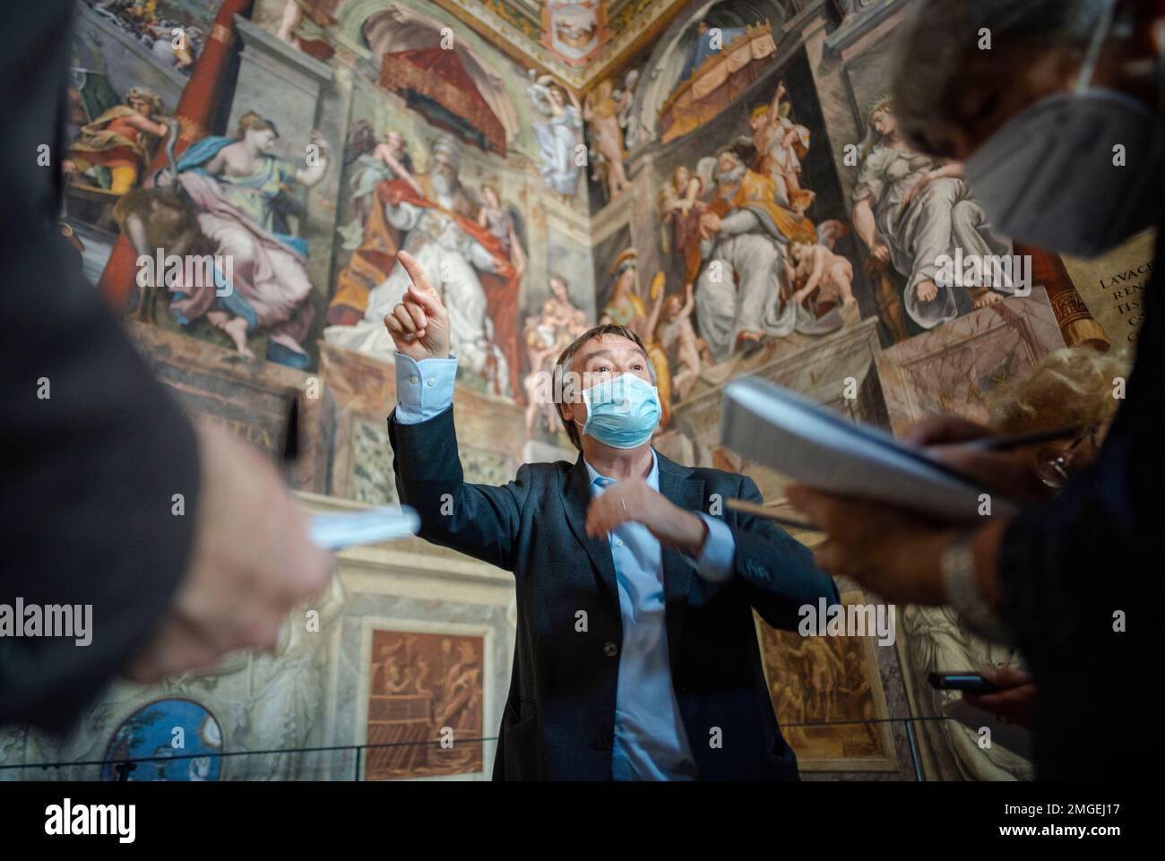 Vatican Museums Scientific Curator Guido Cornini points at the feminine ...