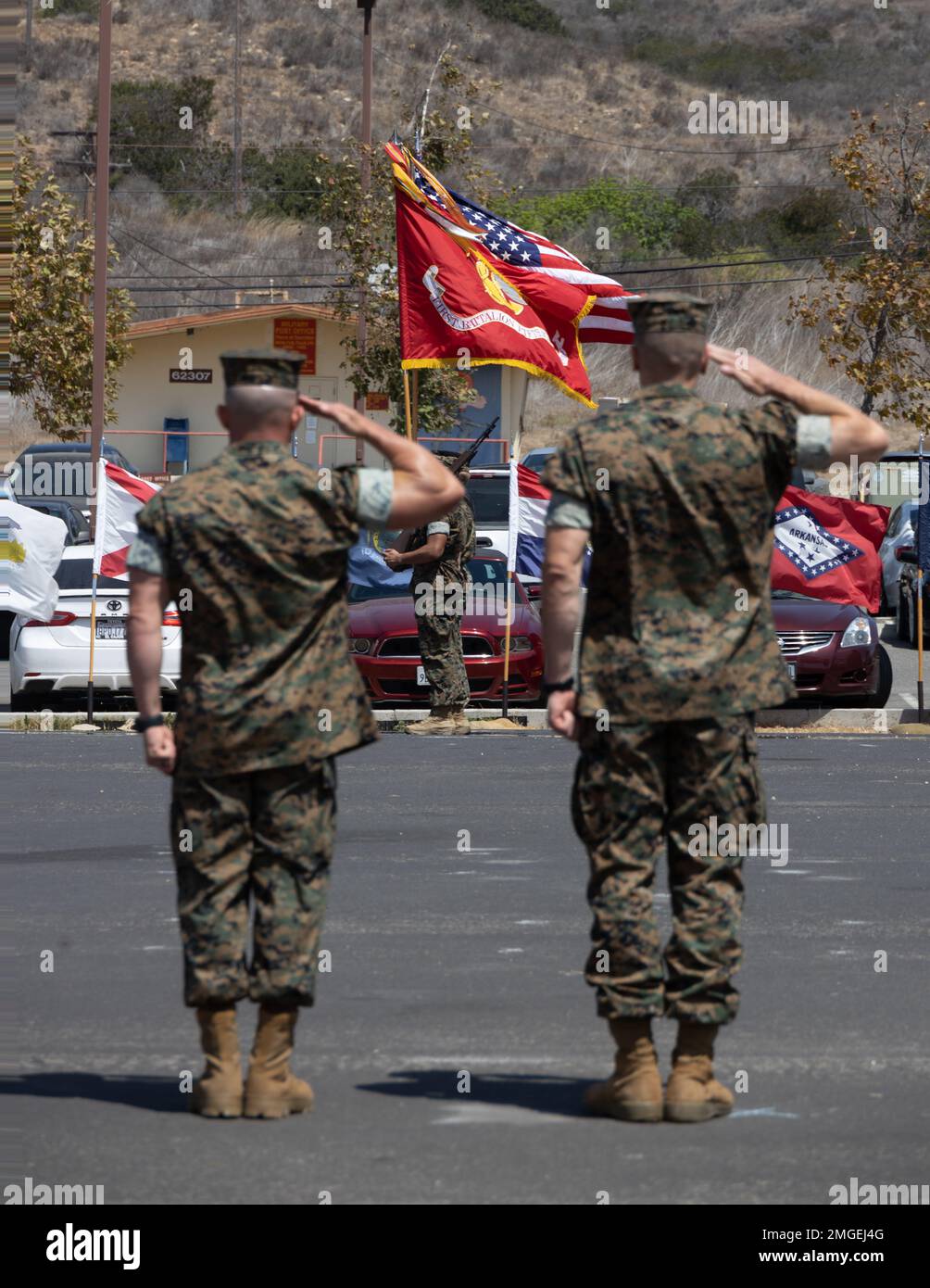 U.S. Marine Corps Sgt. Maj. Roland McGinnis (left), the outgoing ...