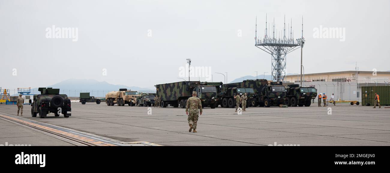 U.S. Soldiers unload vehicles, equipment, and supplies during logistics ...