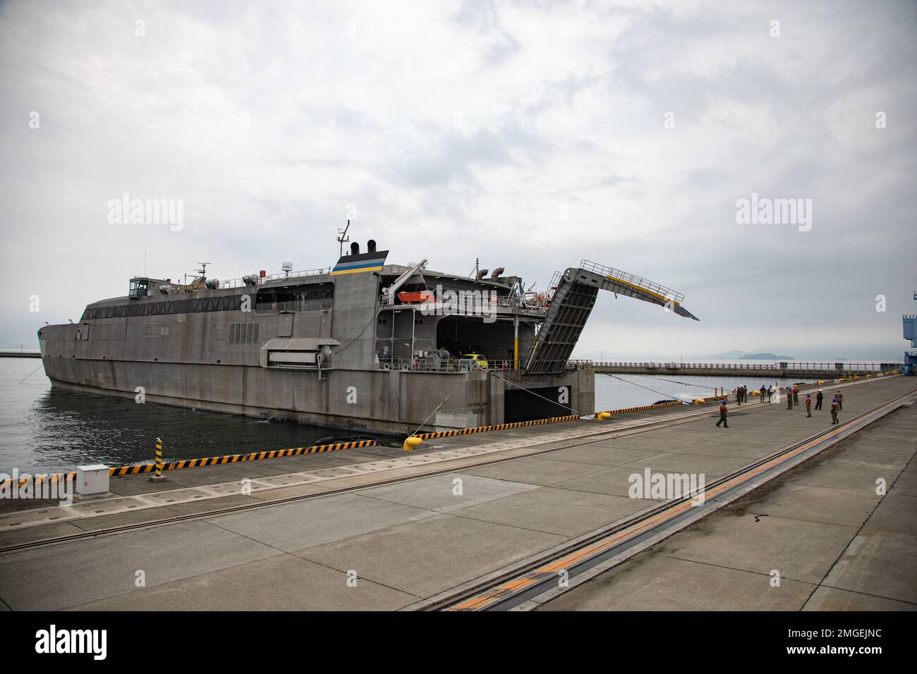 The high-speed transport vessel USNS Guam (T-HST-1) extends a bridge in ...