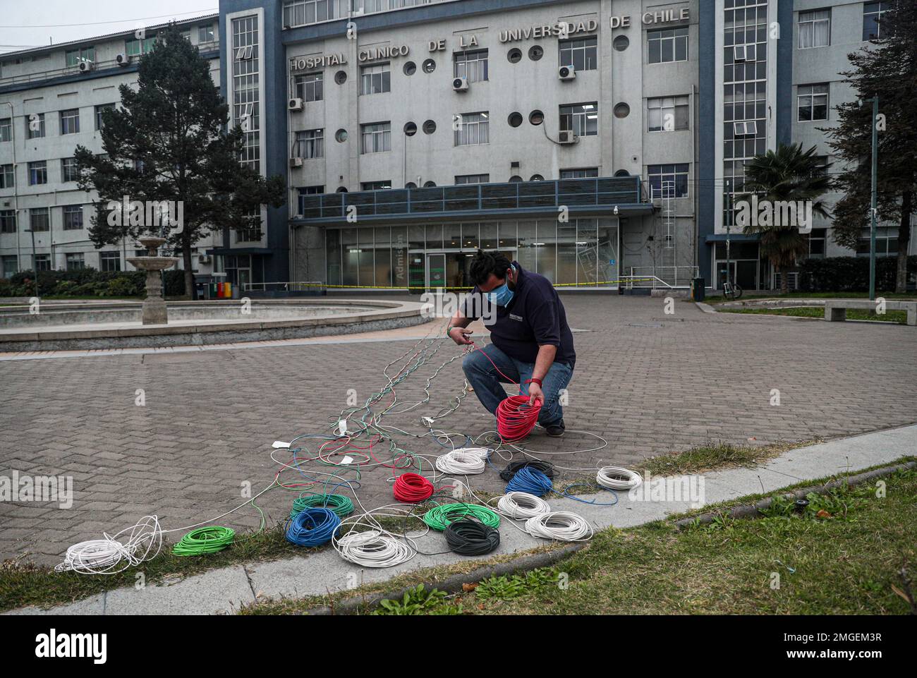 A worker prepares cables as the admissions room of the Clinical ...