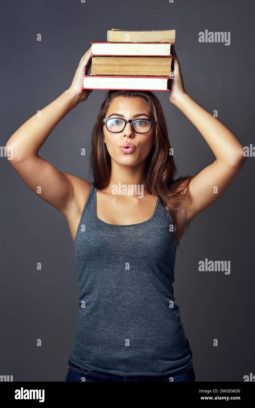 Woman balancing books head hi-res stock photography and images - Alamy