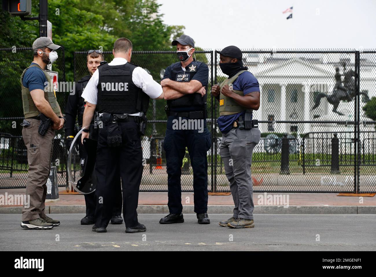 Members of the U.S. Secret Service stand near Lafayette Park across ...
