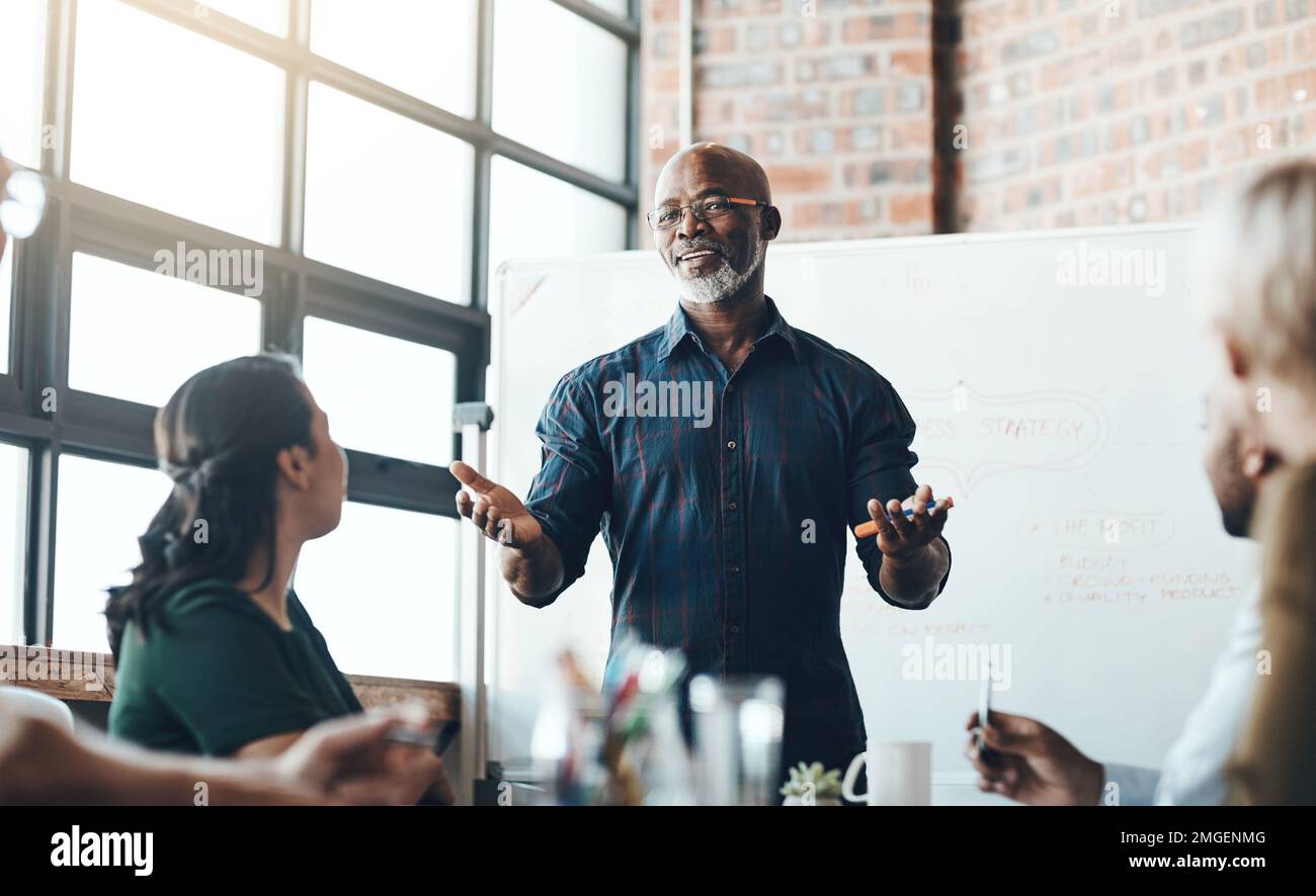 Hes always helping others to grow professionally. a businessman giving ...