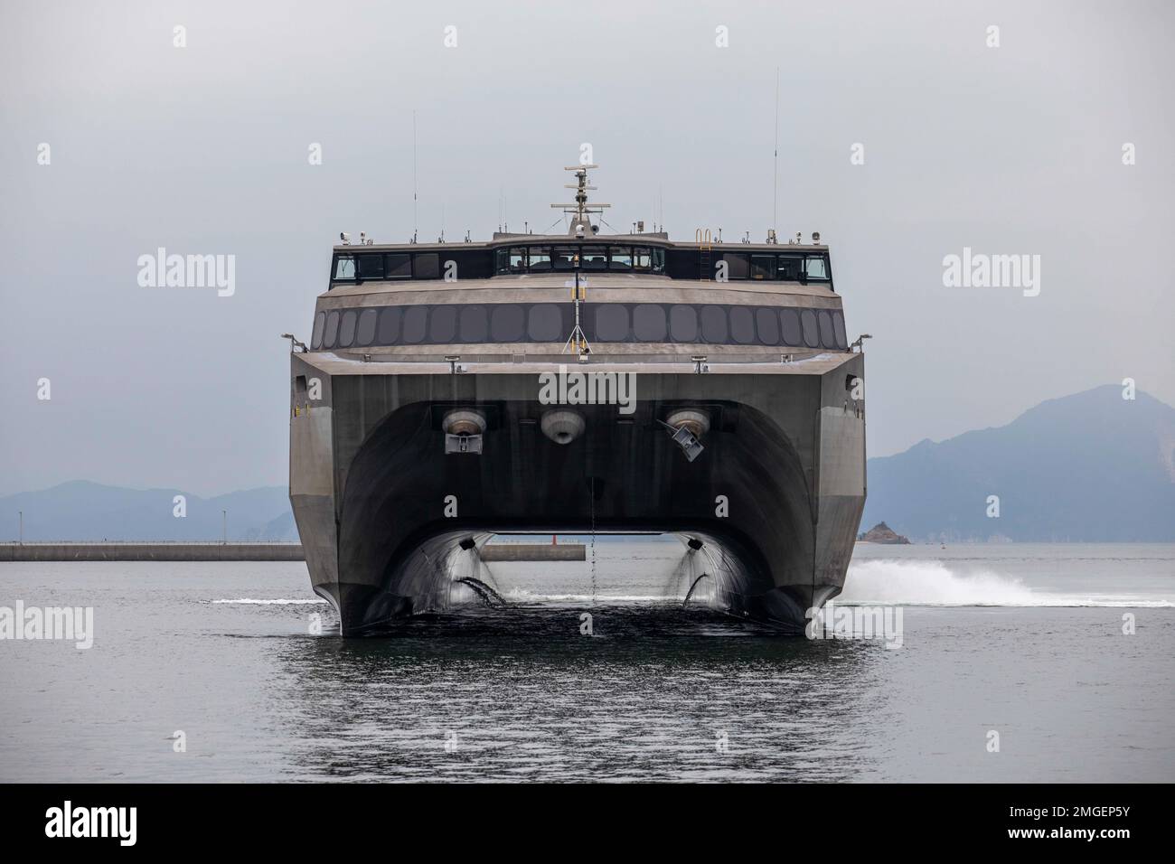 The high-speed transport vessel USNS Guam (T-HST-1) prepares to dock at ...