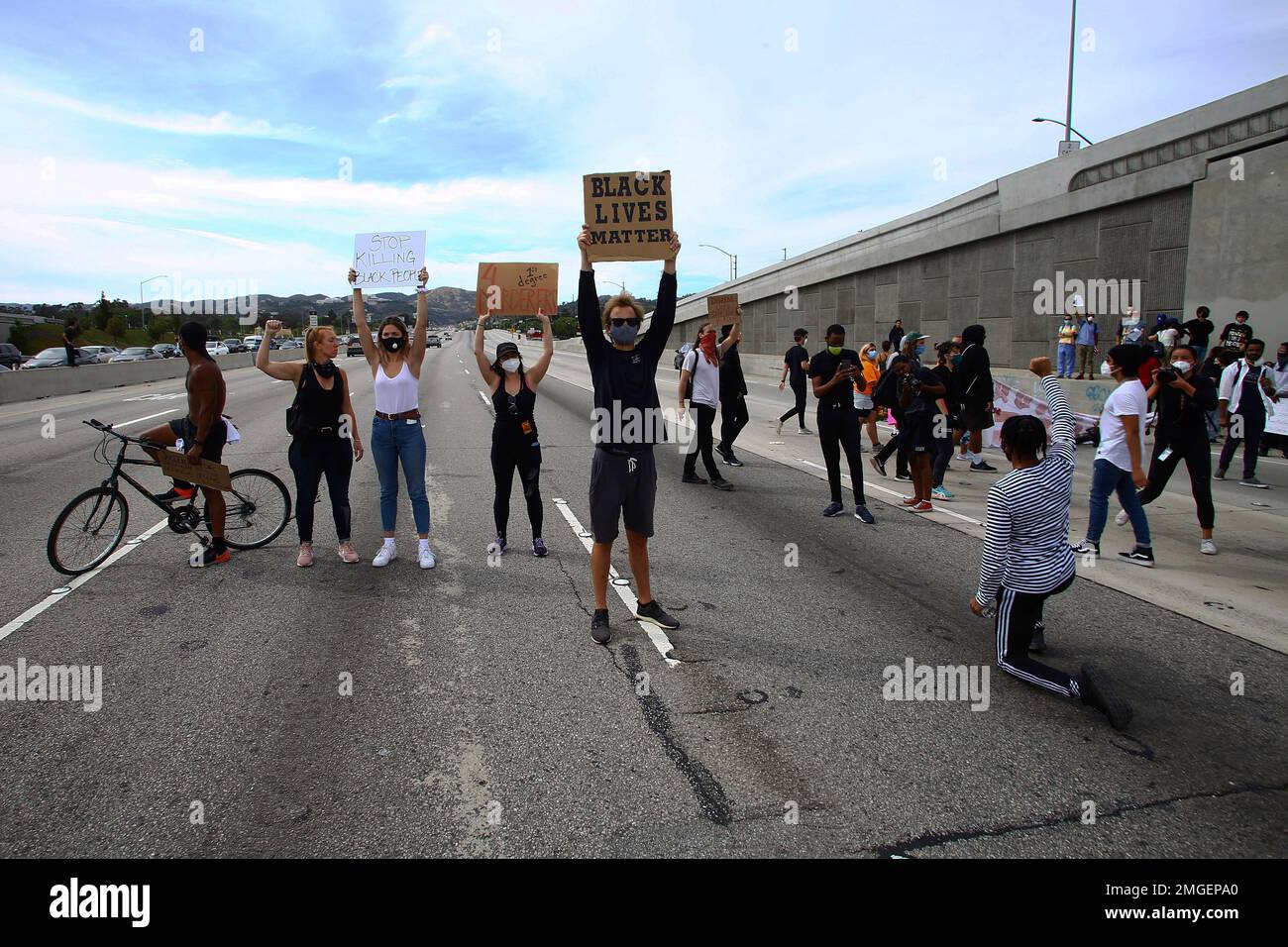 Protesters block traffic on the 405 freeway in Los Angeles during a ...