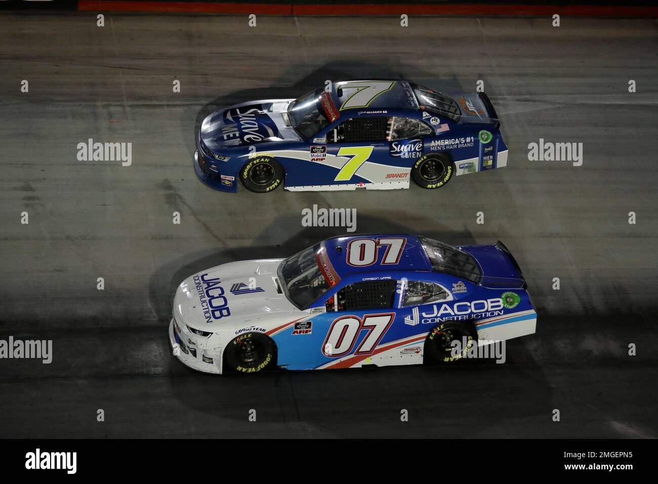 Carson Ware (07) takes the low line as Justin Allgaier (7) goes high on ...