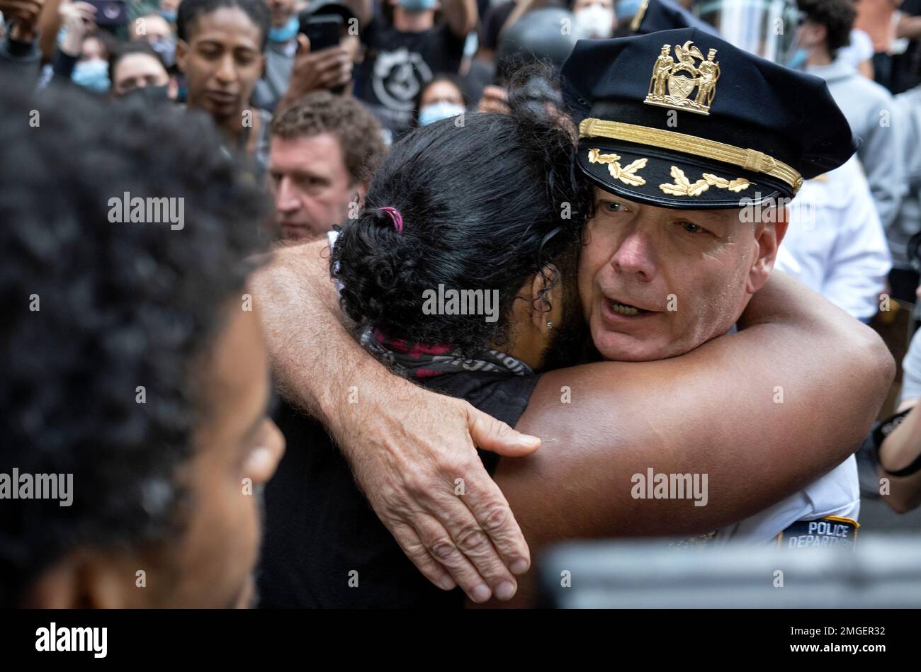 Chief of Department of the New York City Police, Terence Monahan, hugs ...