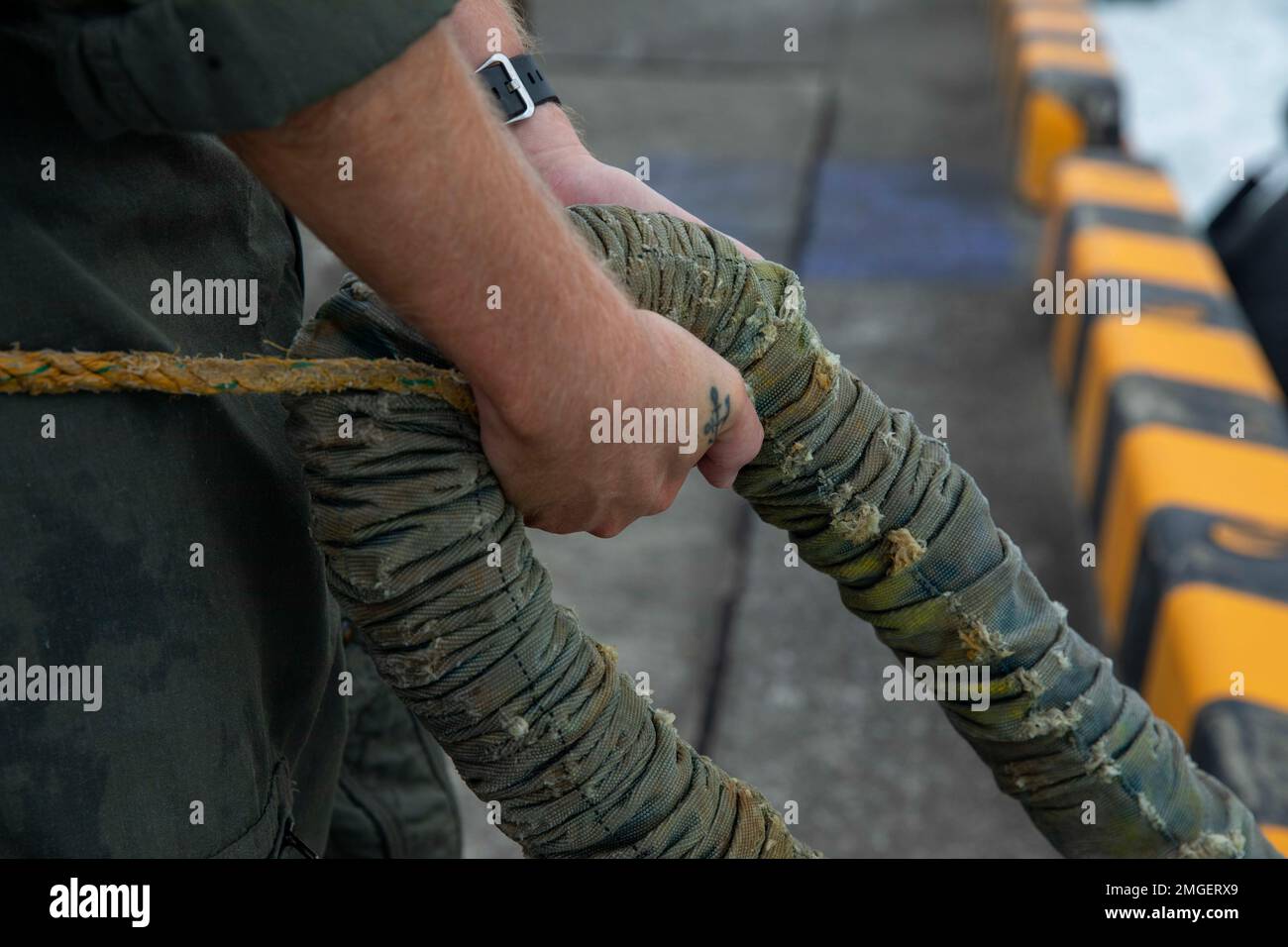 A U.S. Sailor assigned to Marine Corps Air Station Iwakuni’s harbor ...