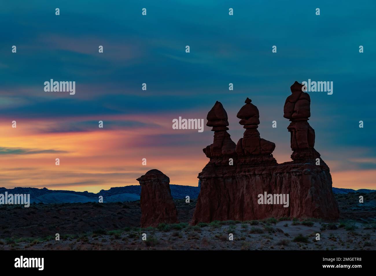 Yjhe suns sets behind the formation know as Three Sisters at Goblin Valley State Park, Emery ...