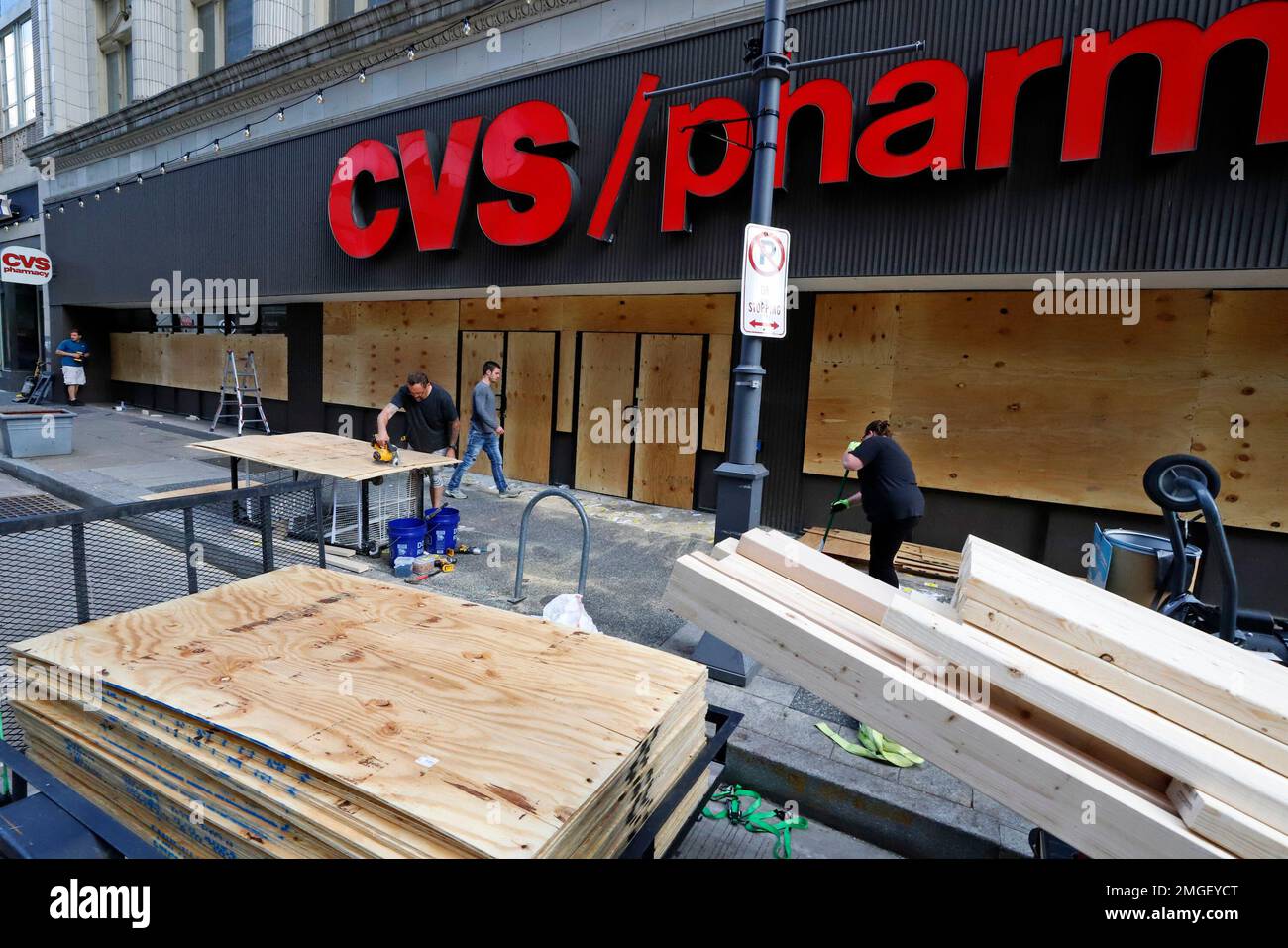 Windows broken in a downtown Pittsburgh CVS Pharmacy are repaired ...