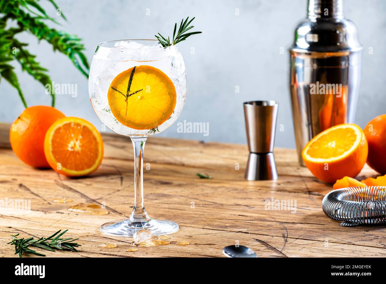 Gin tonic orange cocktail with dry gin, bitter tonic, rosemary and ice ...