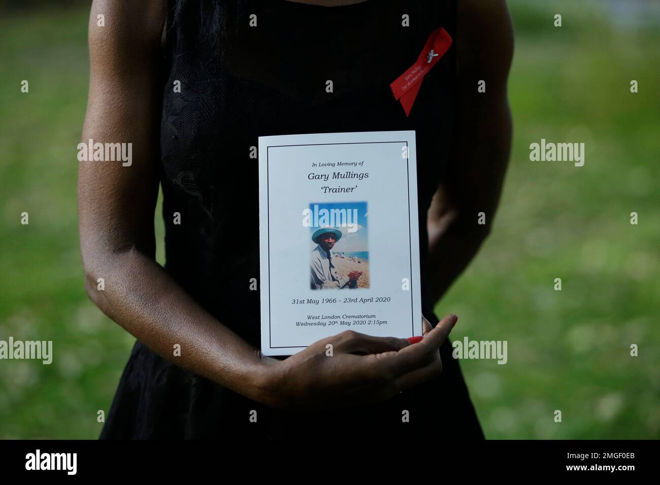 Local resident Marcia Mullings poses for photographs with an order of ...