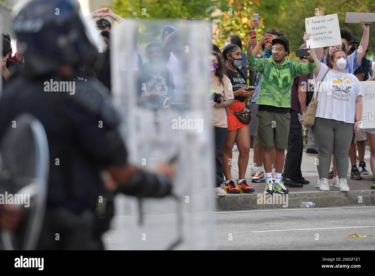 Atlanta Police, dressed in riot gear monitor demonstrators protesting ...