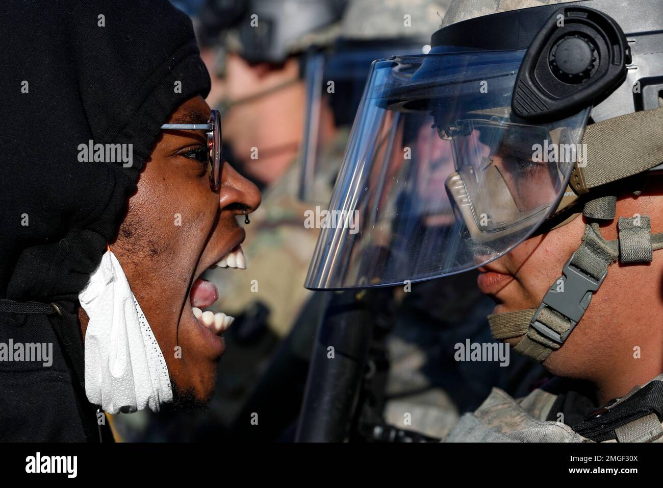 Protesters and National Guardsmen face off on East Lake Street, Friday ...