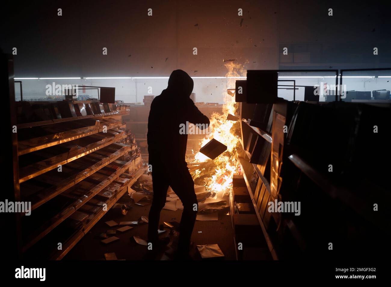 People loot then burn an Office Depot Friday, May 29, 2020, in ...