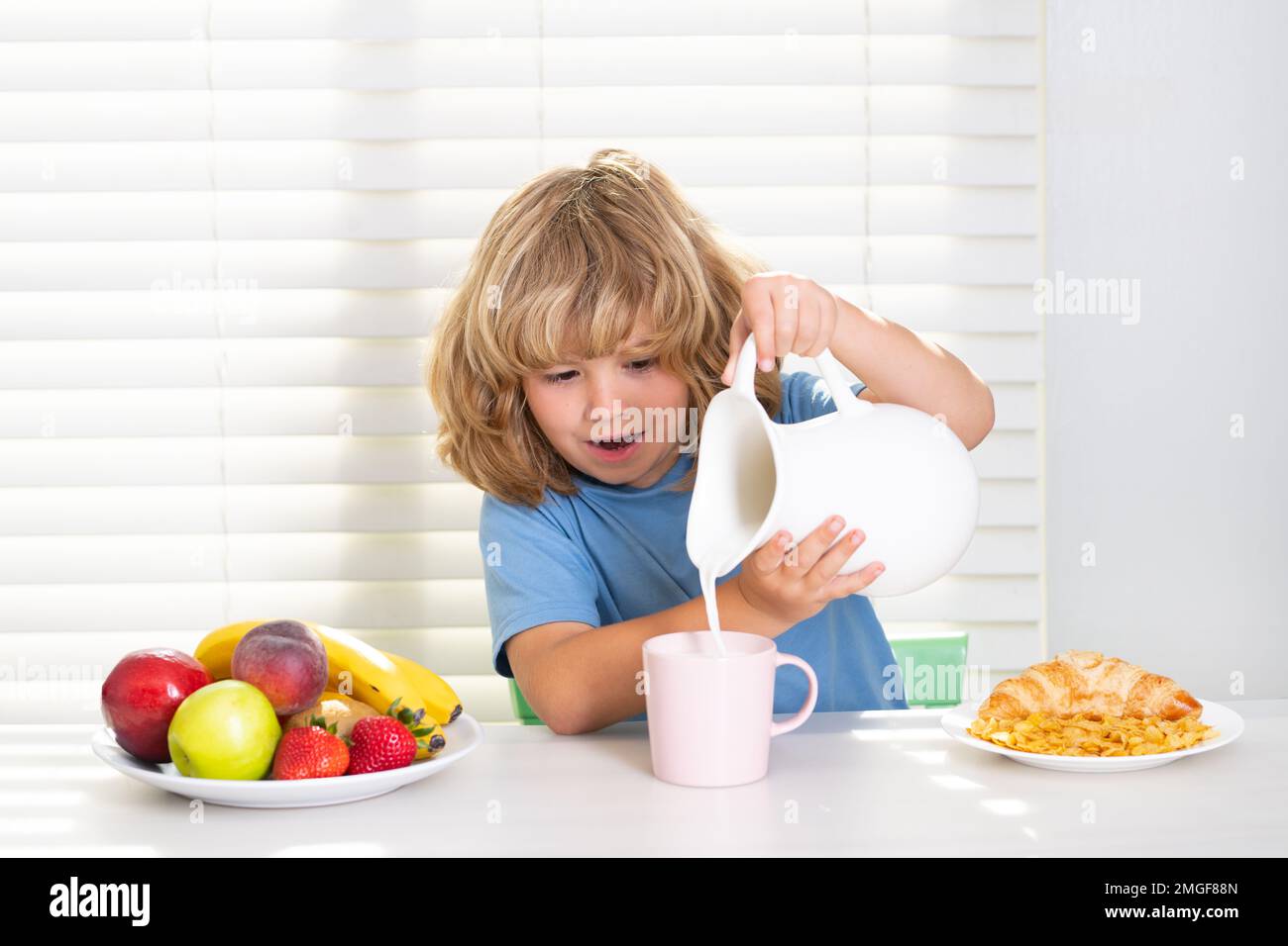 Kid pouring whole cows milk. Healthy food, vegetable dish Stock Photo ...
