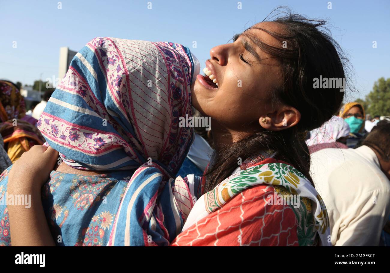 Family members and relatives of Simon Eric, who died in the crash of a ...