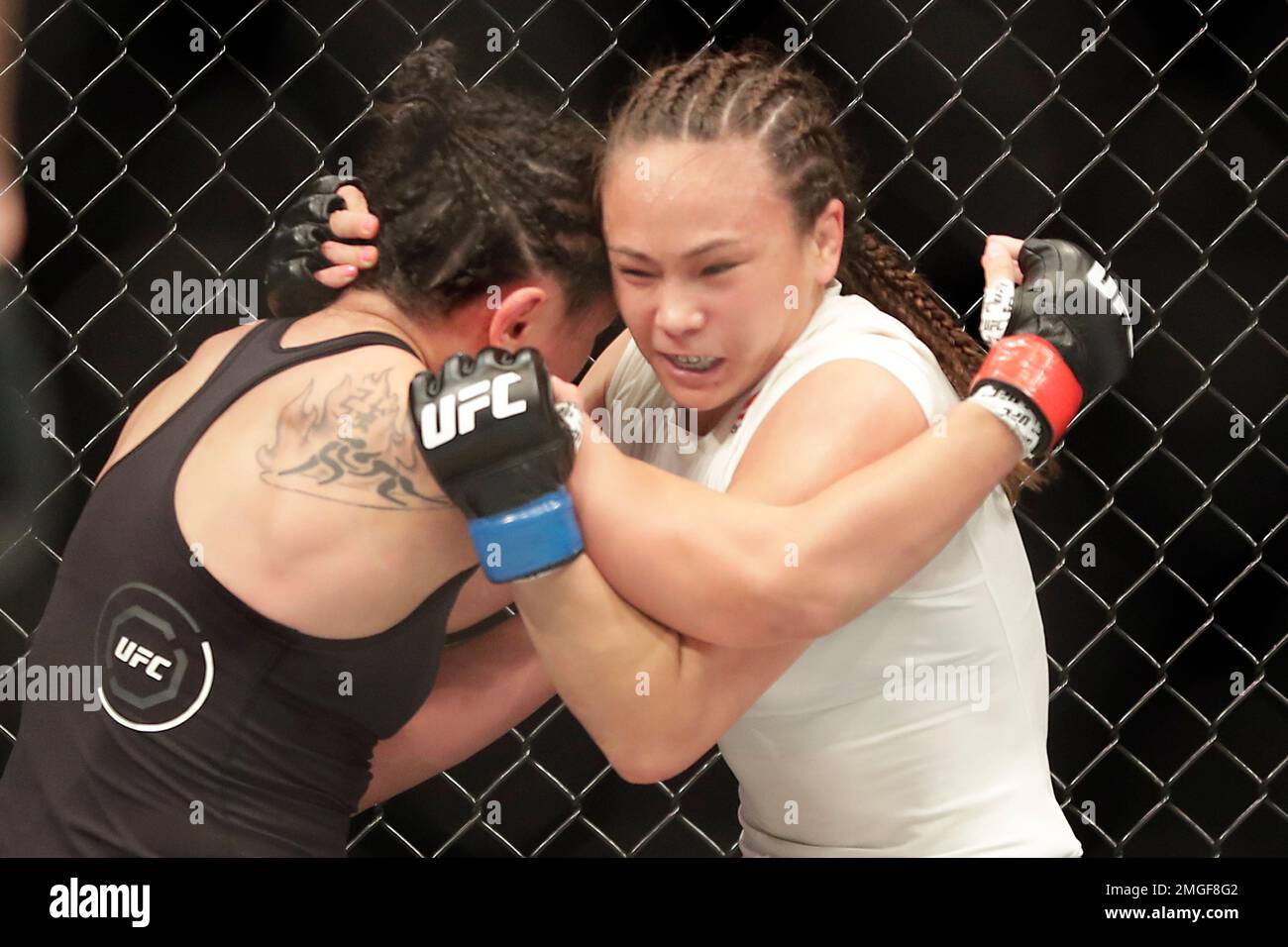 Carla Esparza, left, fights with Michelle Waterson during a UFC 249 ...