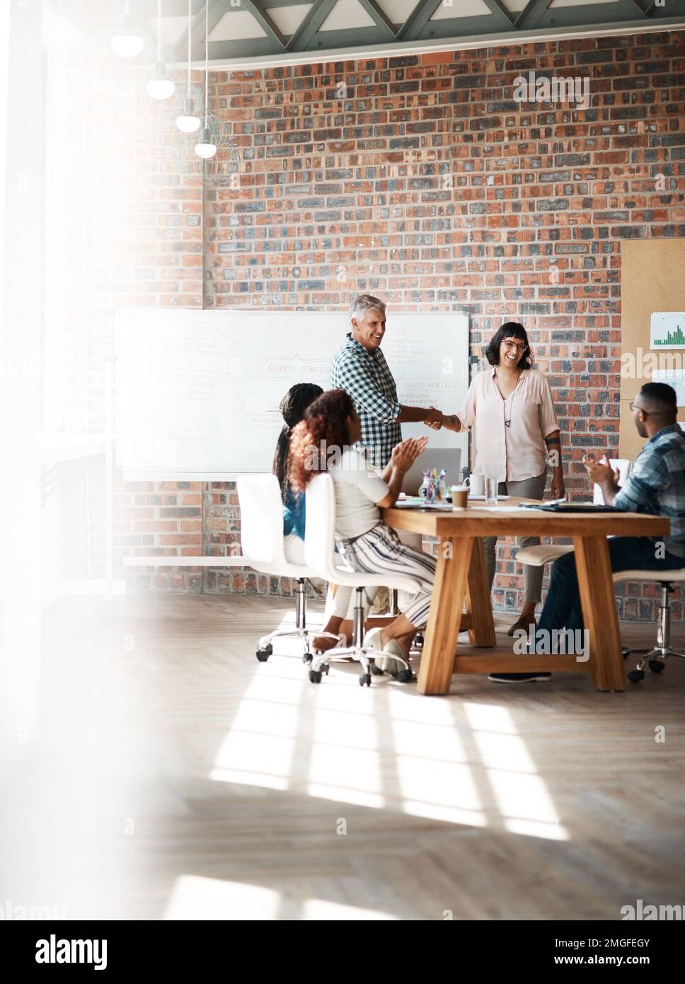 Please welcome our guest speaker. a businessman and businesswoman ...