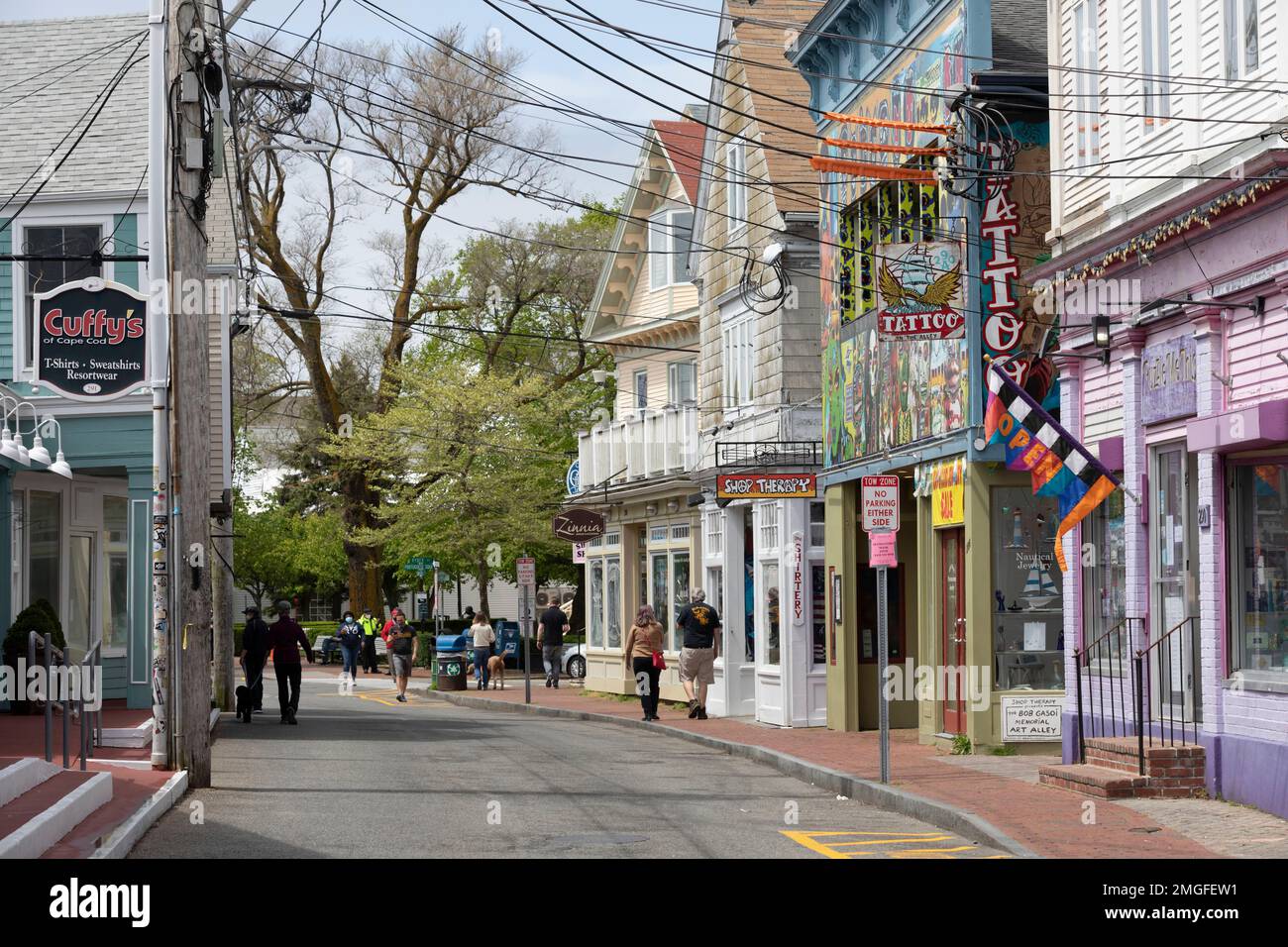 Closed retail stores line the usually crowded Commercial Street, Monday ...