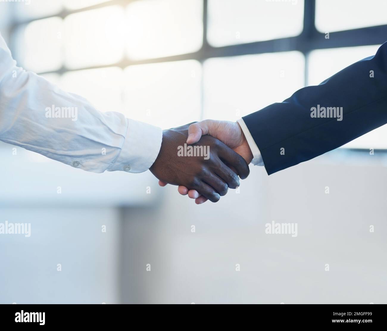 Moving business forward together. two unrecognisable businessmen ...