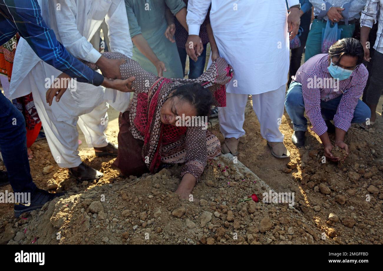 Family members and relatives of Simon Eric, who died in the crash of a ...
