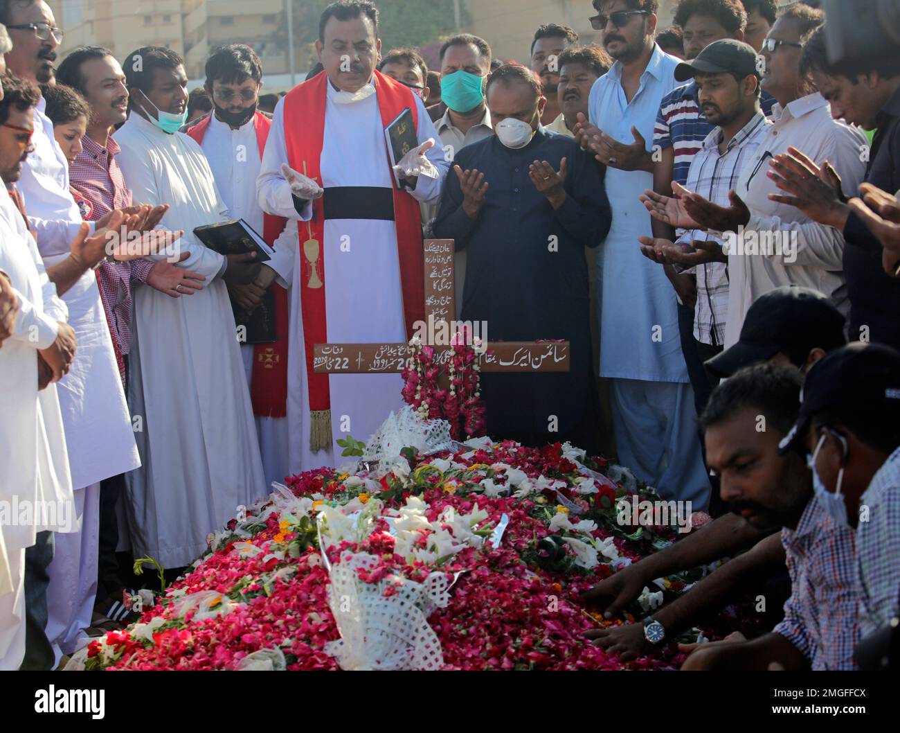 Family members and relatives of Simon Eric, who died in the crash of a ...