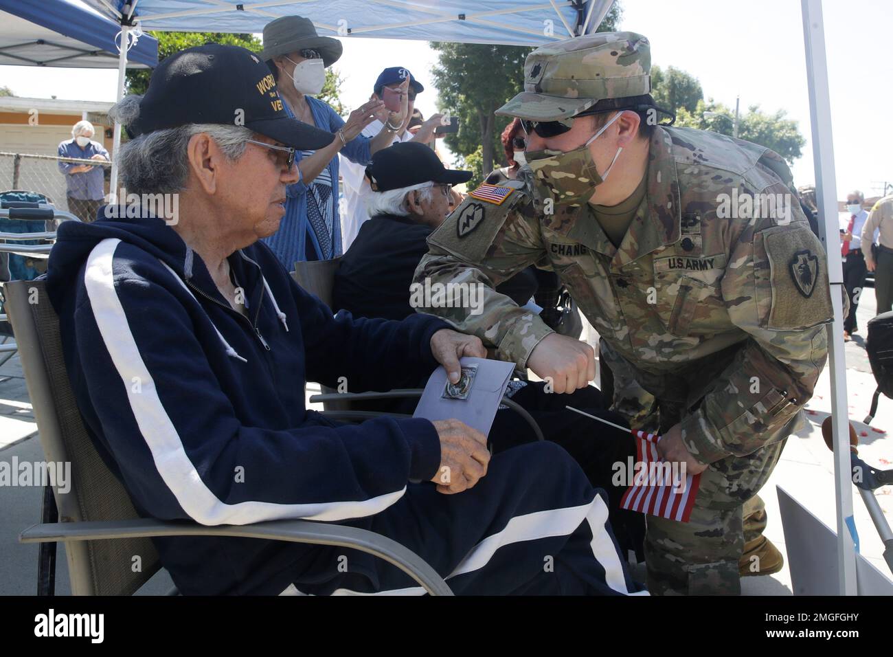 WWII veteran Randy Zepeda, left, bumps elbows with Lt. Col. David S ...