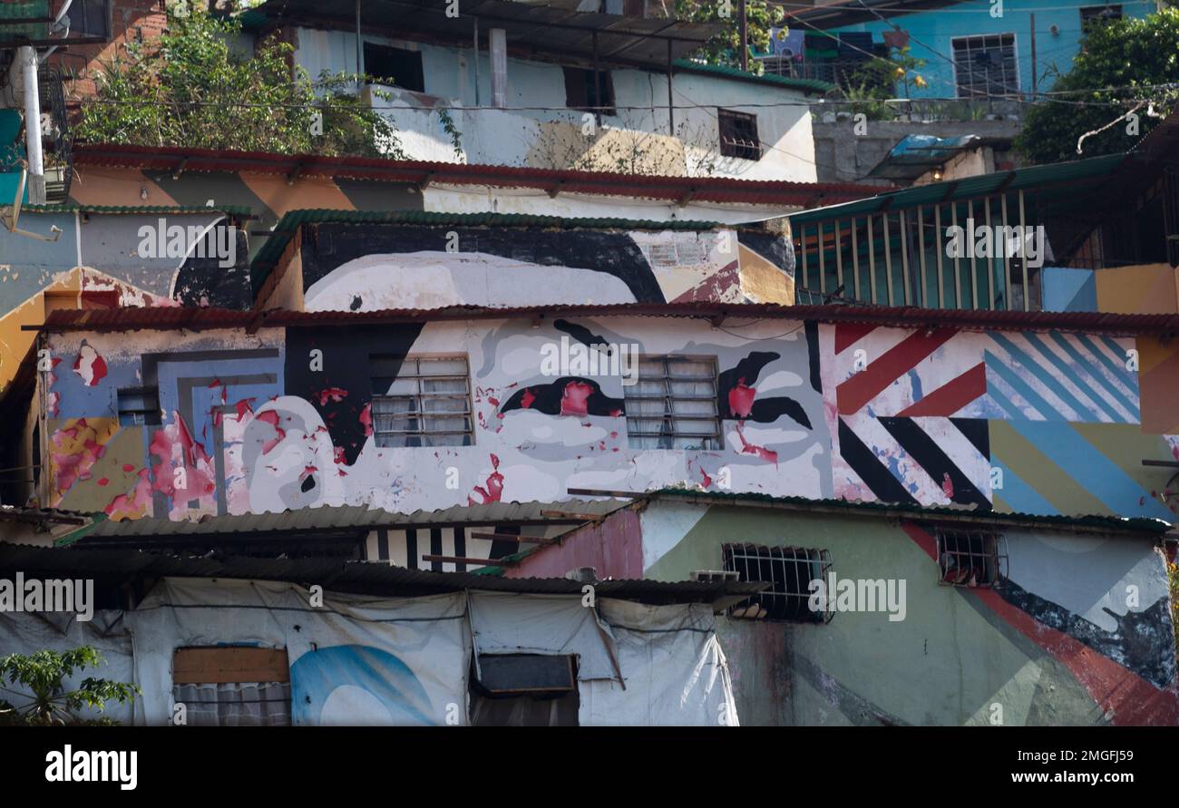 A weathered mural depicts "Chavez eyes" a design based on the eyes of ...