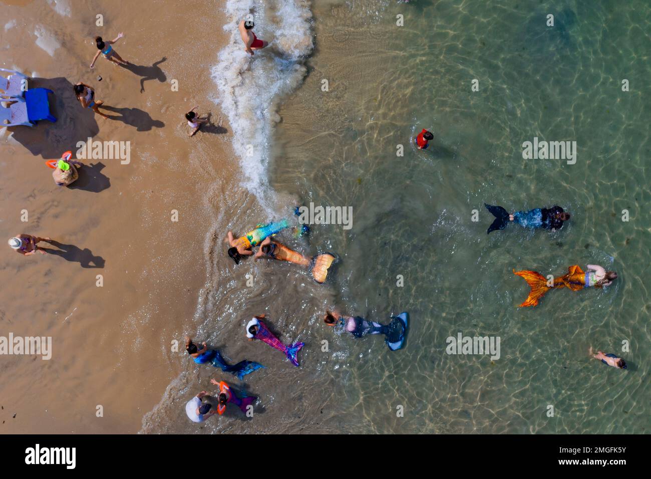 Members of the Israeli Mermaids Community swim with a mermaid tails at ...