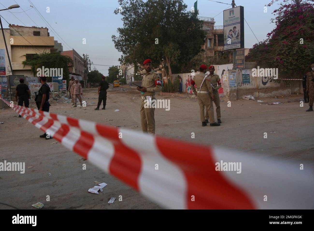 Pakistan army soldiers and police commandos stand guard while they ...