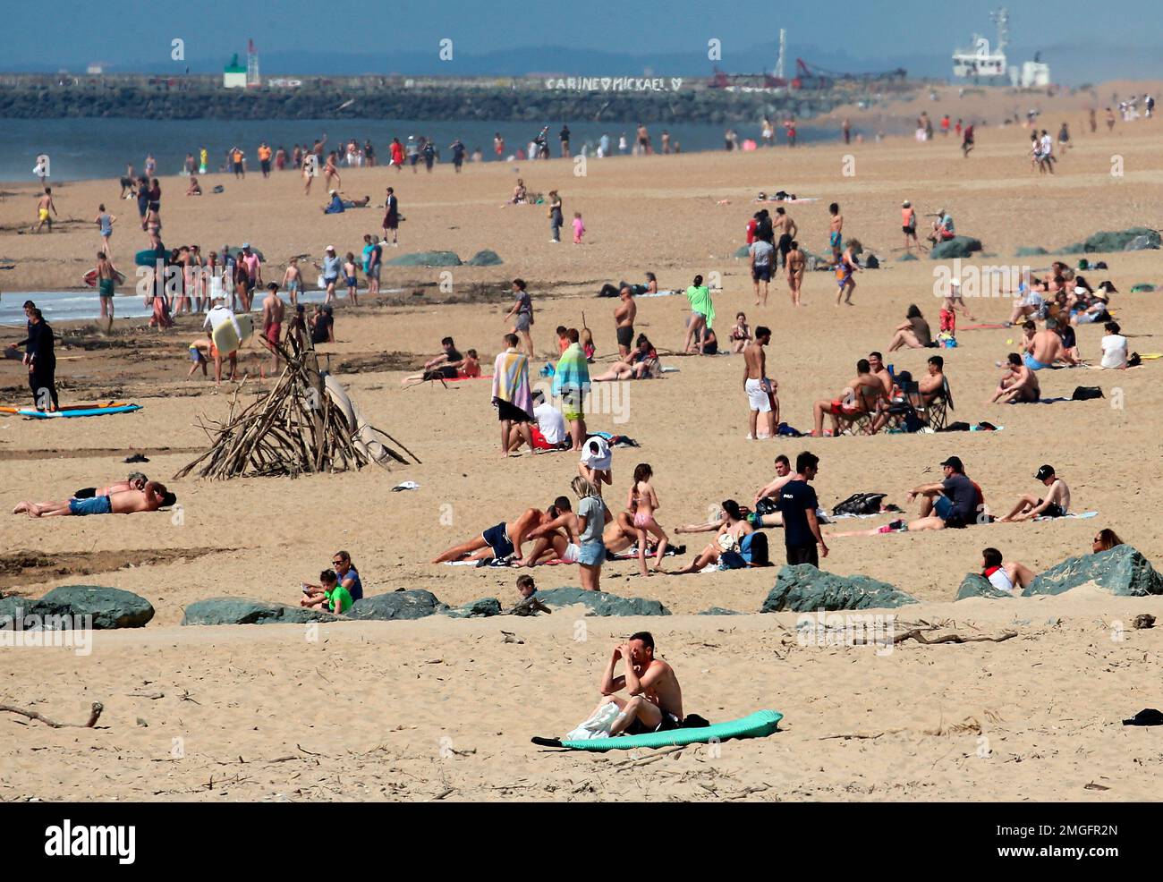 People sit on Anglet beach, southwestern France, Thursday, May 21, 2020 ...