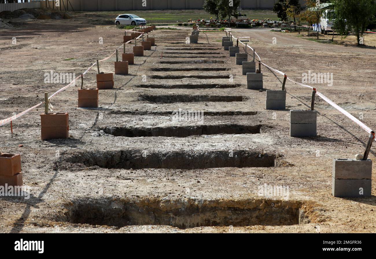 Empty graves are seen at the Durbanville Memorial Park in Cape Town, South Africa, Thursday, May ...