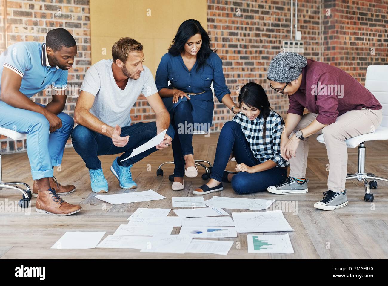 Working on their new ad campaign. a group of businesspeople ...