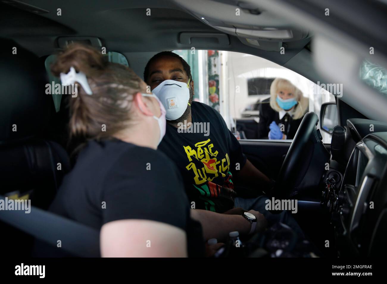 Kerri Sims, left, and Christopher McCall of Las Vegas lean in to kiss ...