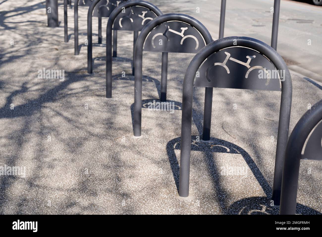 Empty street bike parking made of metal city bikes parked in row at ...