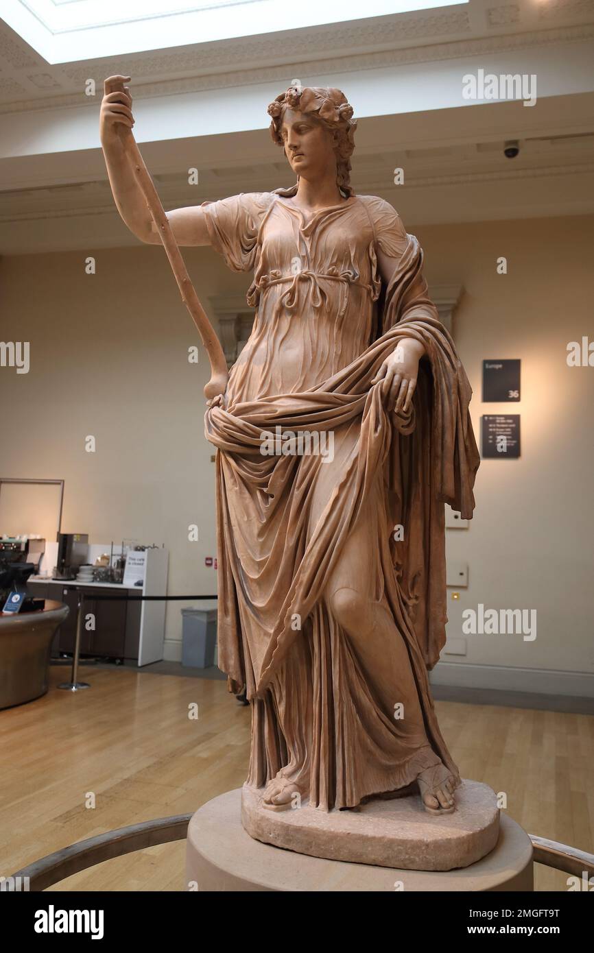 Roman marble statue of a woman wearing a chiton and himation at the ...