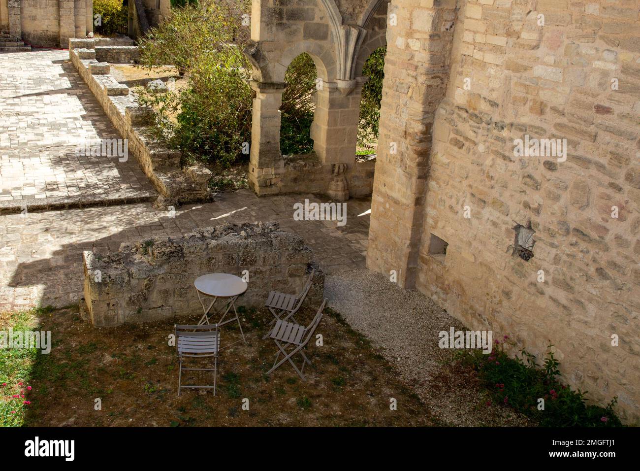 metal grey chair seat table wooden in summer street in ancient medieval ...