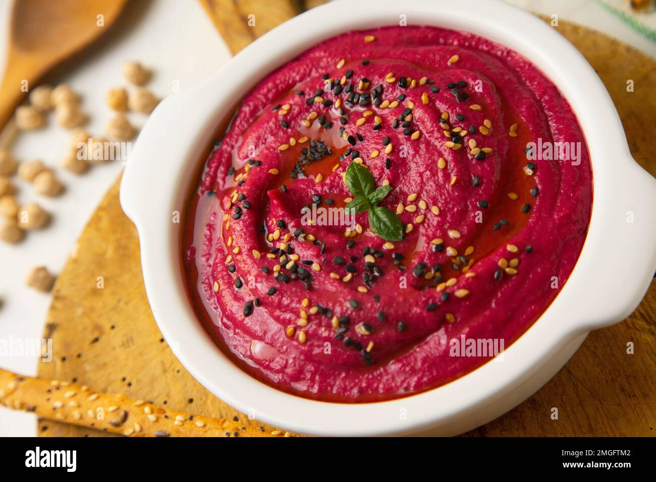 Beetroot hummus with bread sticks Stock Photo - Alamy