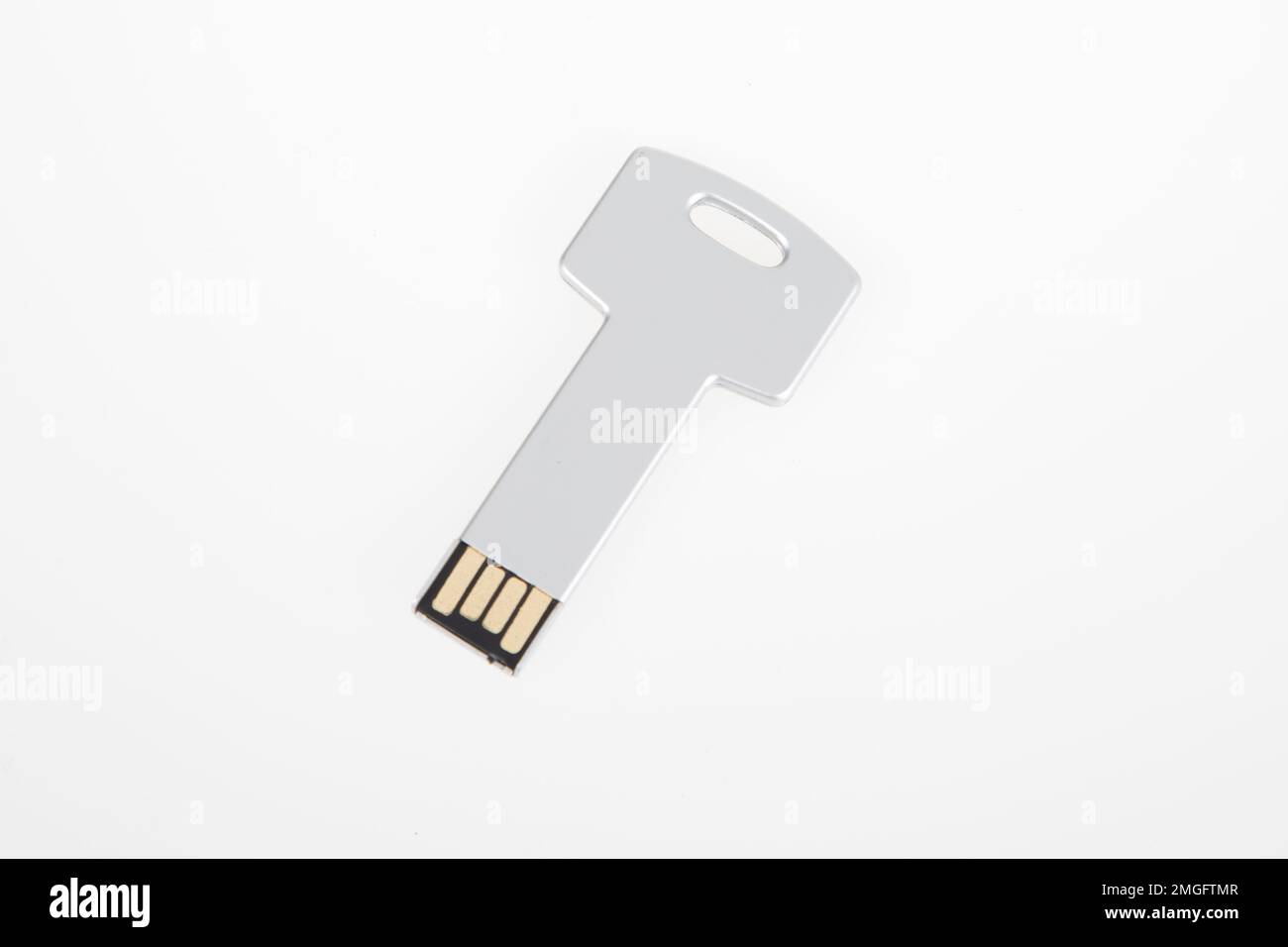 Silver modern Usb stick shaped like a key flash drive on white ...