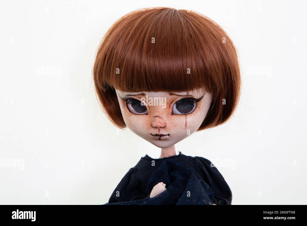 sad makeup doll plastic big eyes Stock Photo - Alamy