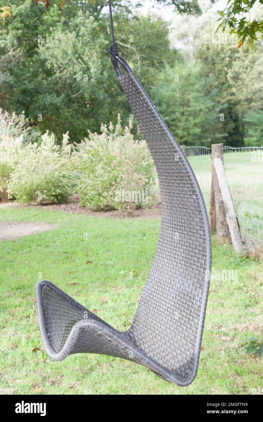 Hanging rattan swing hi-res stock photography and images - Alamy