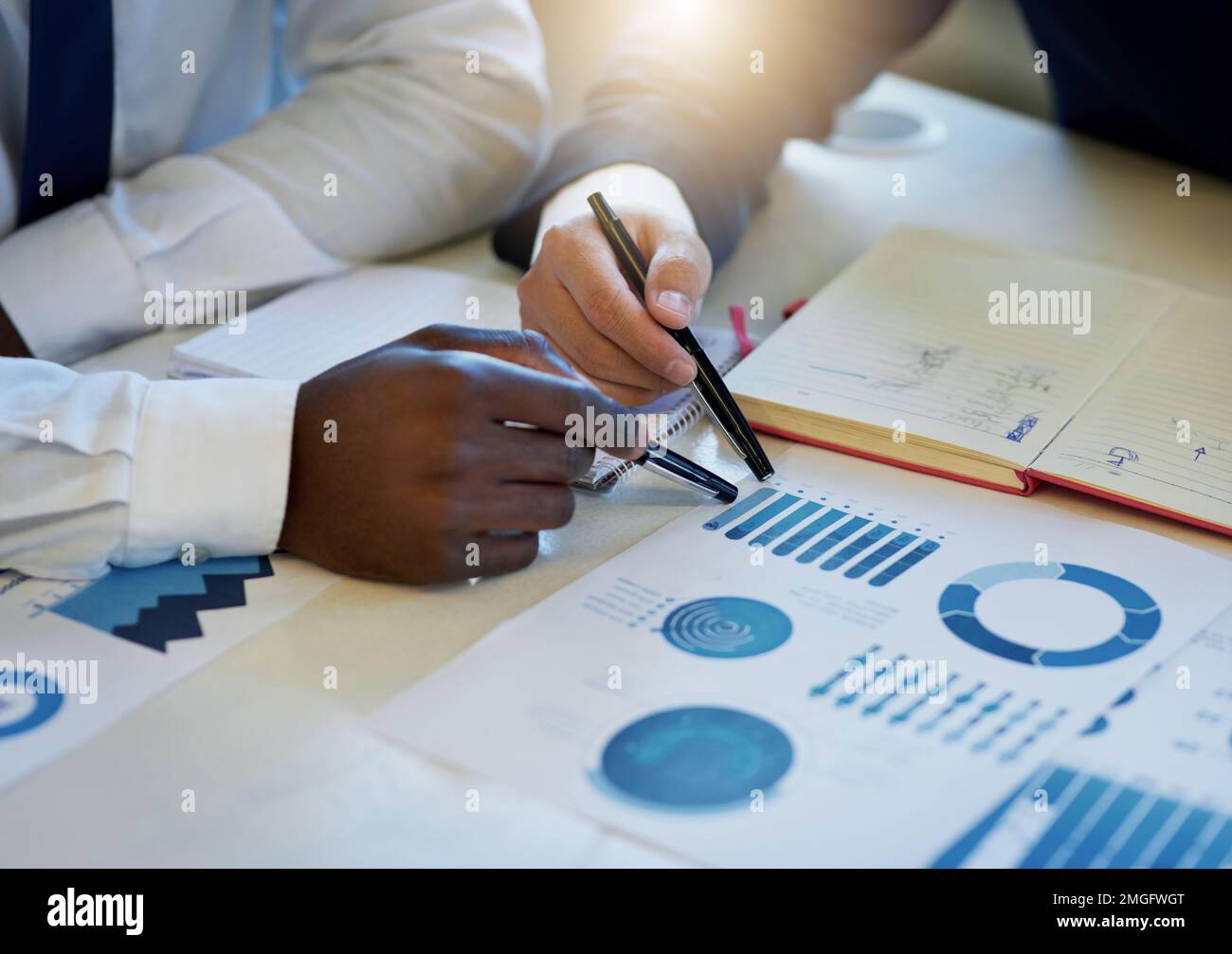 Analysing the latest business reports. two unrecognisable businessmen ...