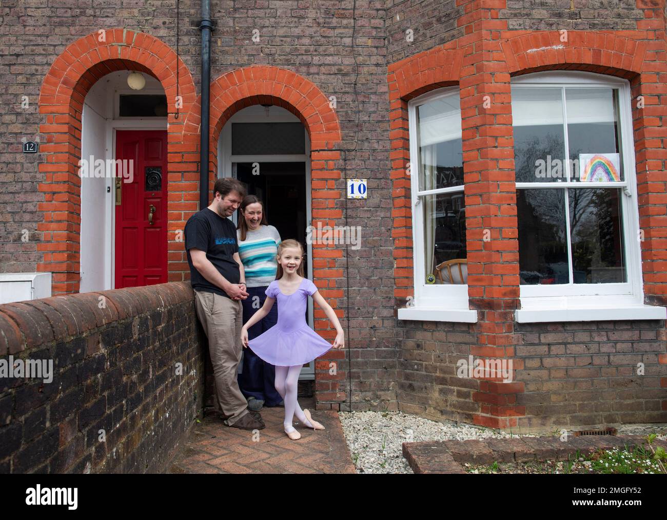 Louise and Will Jenkins look at Clementine curtsey as she prepares for ...