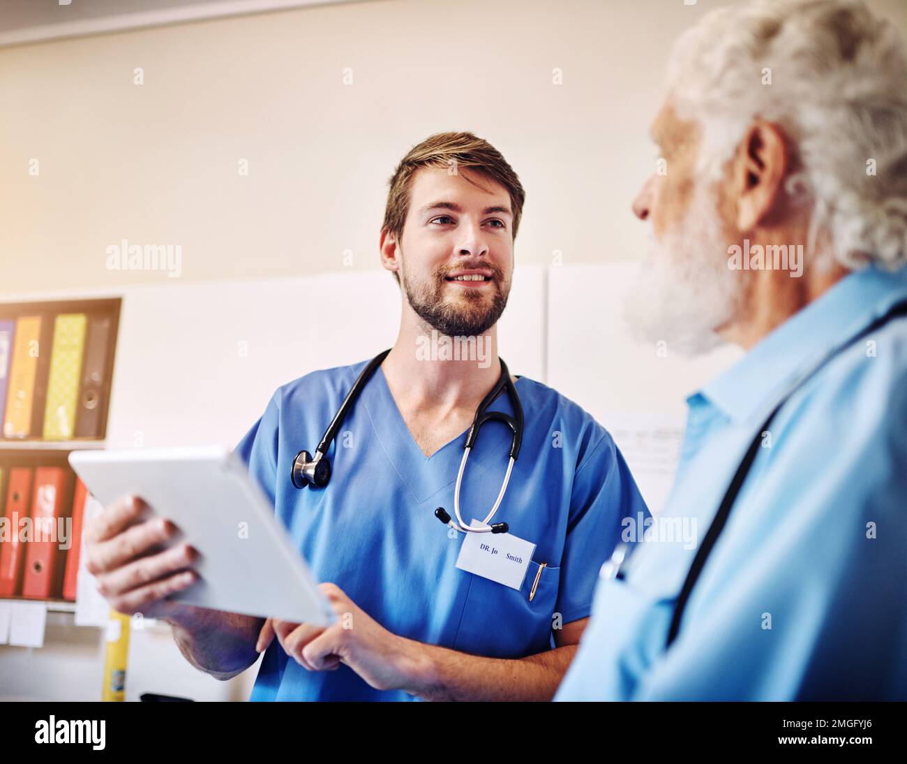 Our new tech helps us assist our patients better. a young doctor using ...